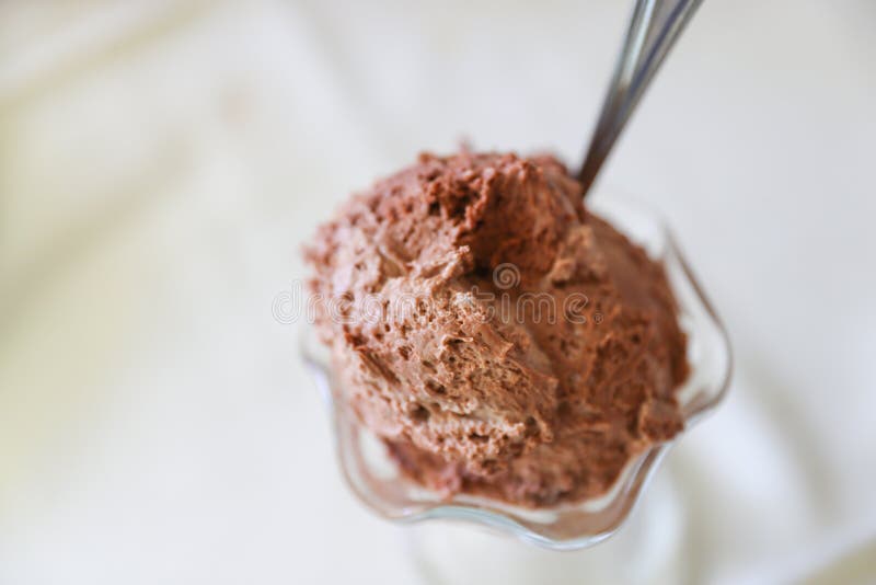 Chocolate Mousse with a Spoon in Portion Glasses on White Table Stock ...