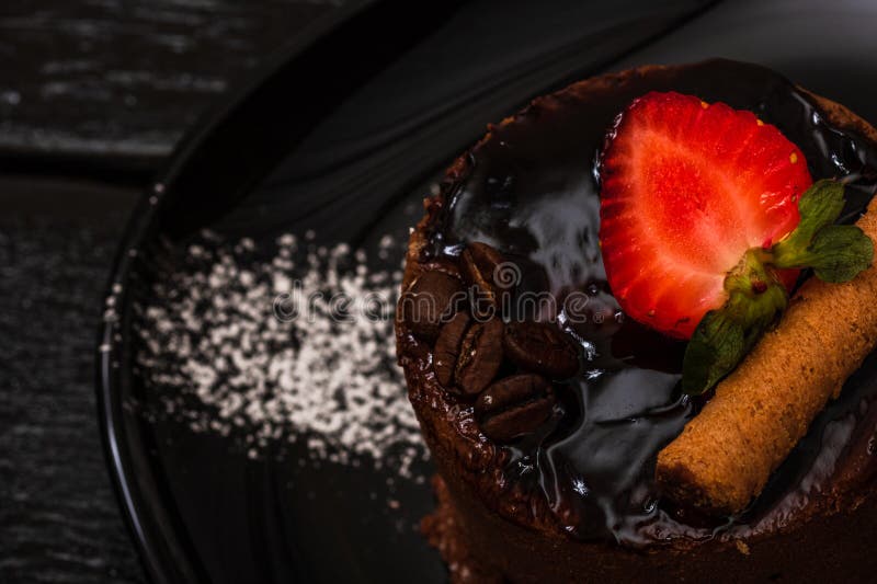 Chocolate Mousse with Strawberry and Chocolate Stick on a Black Dish ...
