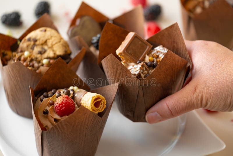 Chocolate Muffin in Hand .Chocolate Dessert.sweet Table. Sweets and ...