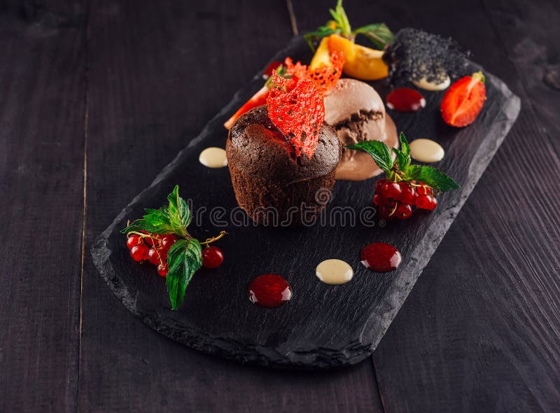 Chocolate Muffin And Ice Cream Dessert Sitting On Black Slate Cutting