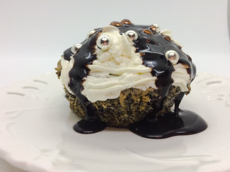 Chocolate Muffin with Silver Pieces on White BackgroundChocolate Muffin ...