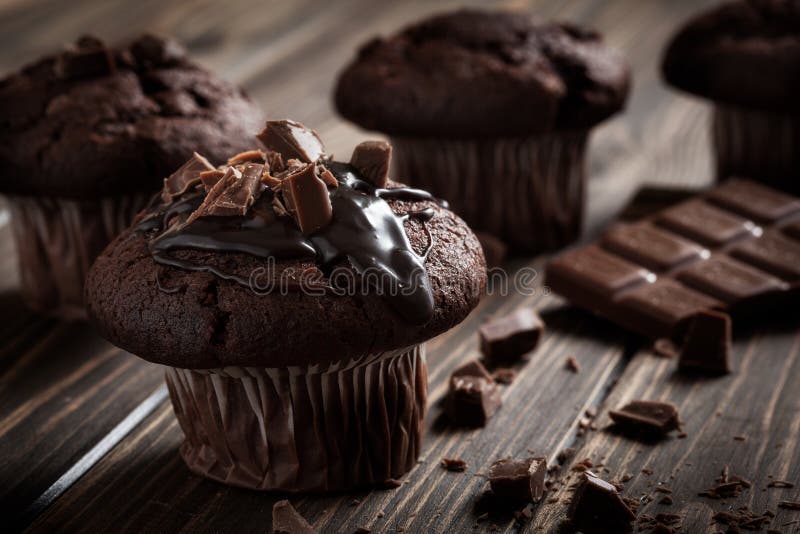 Chocolate Muffins with Icing and Chocolate Pieces Stock Photo - Image ...