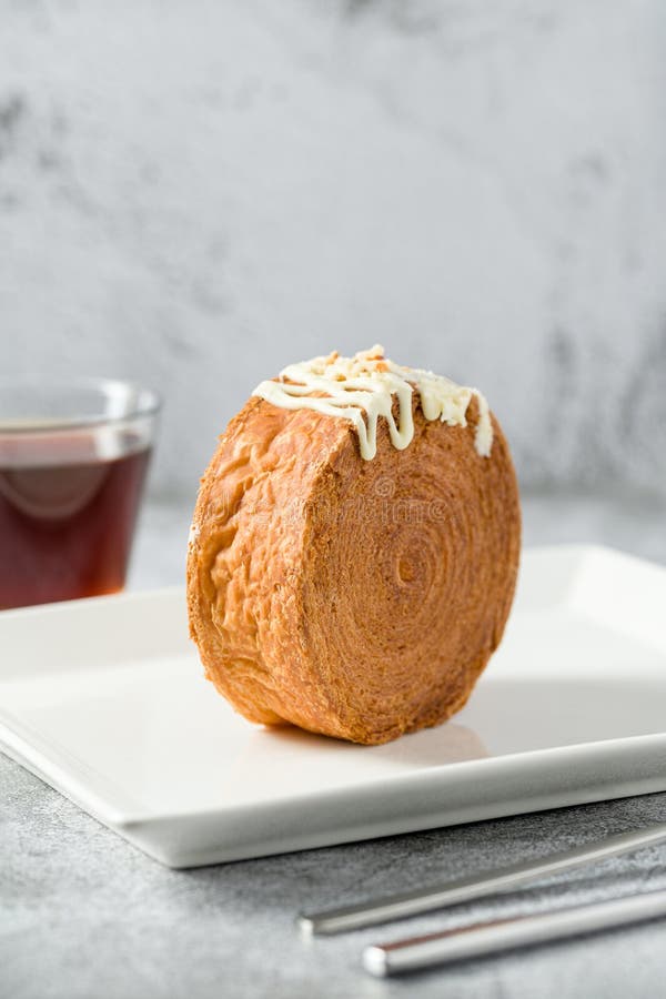 Chocolate New York Roll or Round Croissant with Tea on Stone Table ...