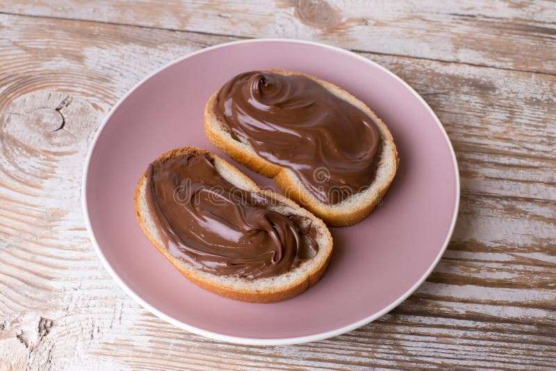Chocolate-nut Cream Spread on Slices of Bread. Stock Image - Image of ...