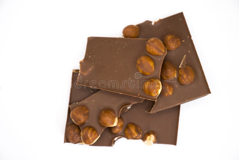 Chocolate Pieces Tasty Hazelnuts on a White Background Stock Photo ... Chocolate Pieces Tasty Hazelnuts on a White Background Stock Photo ...