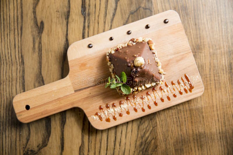 Chocolate Pyramid Shape Cake with Nuts Stock Photo - Image of almond ...