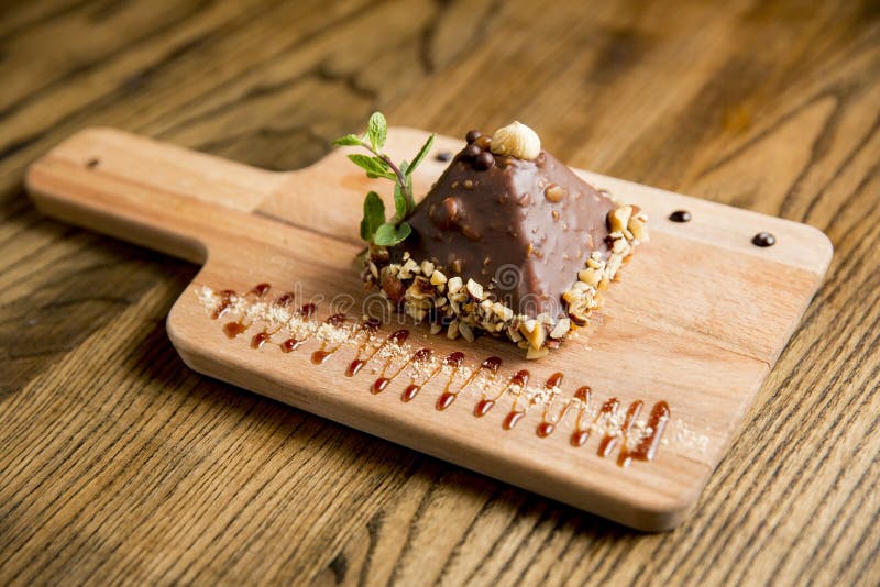 Chocolate Pyramid Shape Cake with Nuts Stock Photo - Image of wood ...