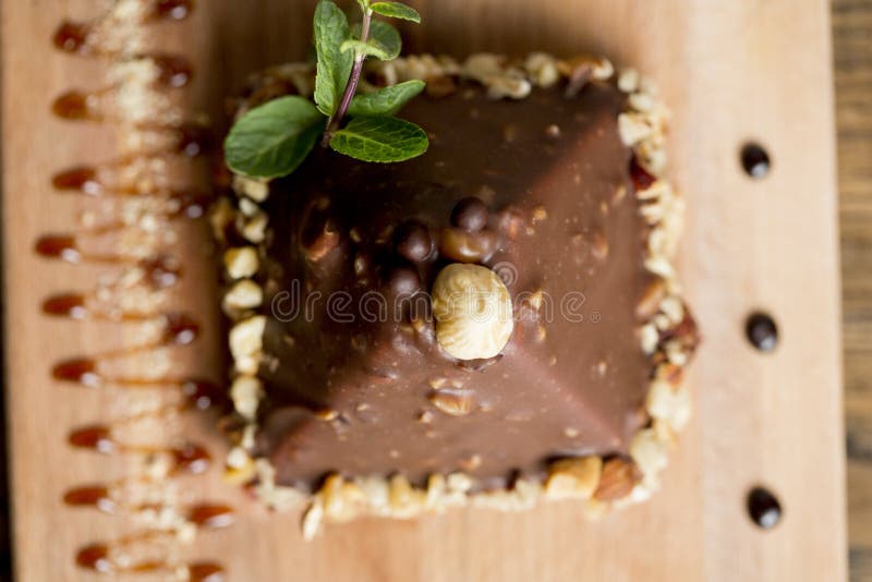Chocolate Pyramid Shape Cake with Nuts Stock Photo - Image of wood ...