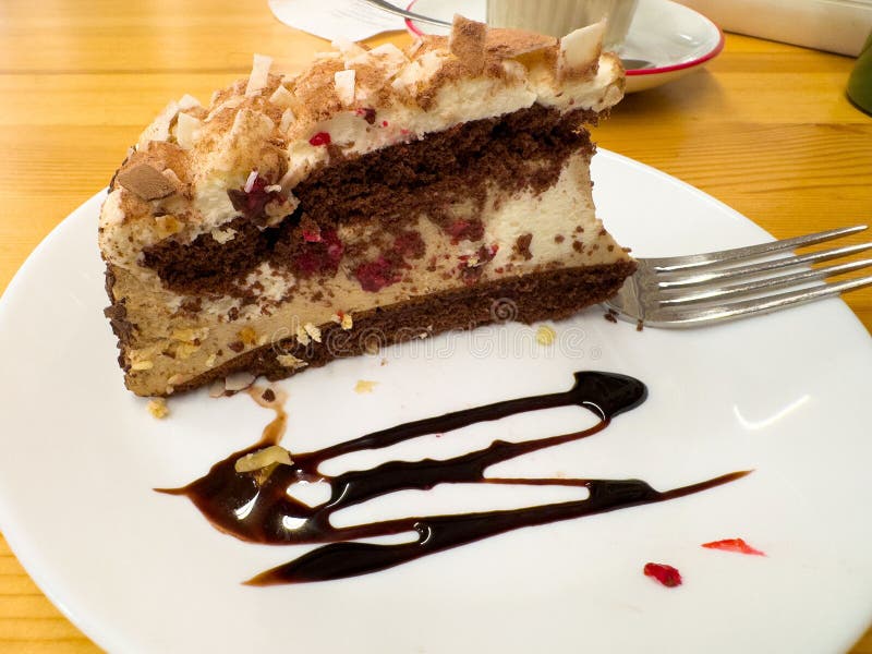 Chocolate Raspberry Layer Cake Slice with Creamy Filling on a Plate ...