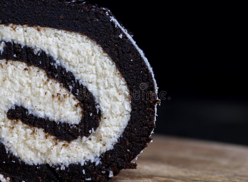Chocolate Roll with a Creamy Curd Layer in Coconut Chips Stock Photo ...