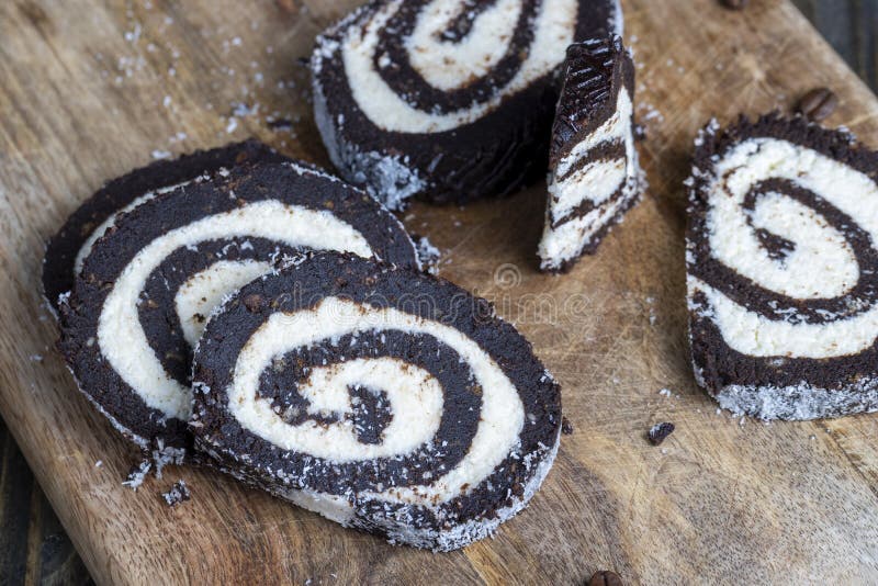 Chocolate Roll with a Creamy Curd Layer in Coconut Chips Stock Photo ...