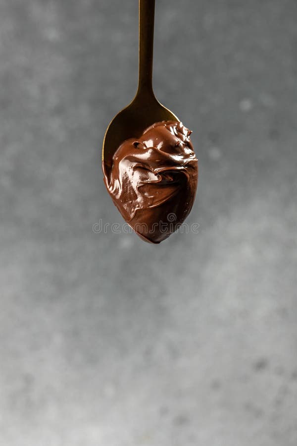 Chocolate Spread and Hazelnuts on a Spoon, Vertical Image. Place for ...
