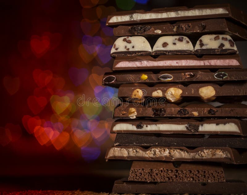 Chocolate Stack on Colorful Bokeh Background Stock Photo - Image of ...