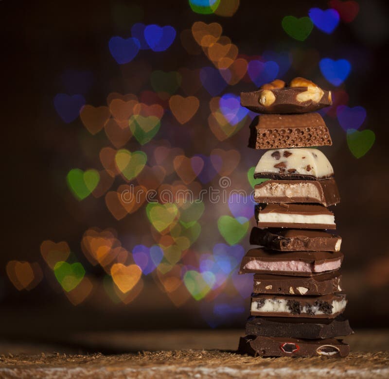 Chocolate Stack on Colorful Bokeh Background Stock Image - Image of ...