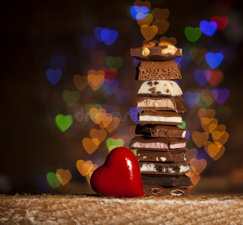 Chocolate Stack on Colorful Bokeh Background Stock Image - Image of ...