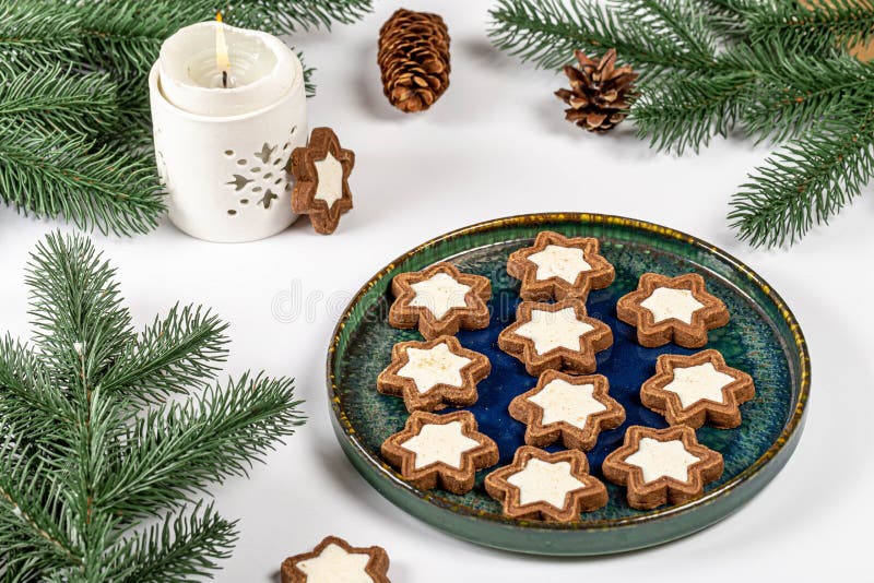 Chocolate Star Cookies with Branches of a Christmas Tree and Burning ...
