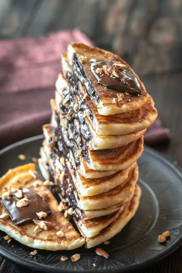 Chocolate stuffed pancakes stock photo. Image of baked - 127603432