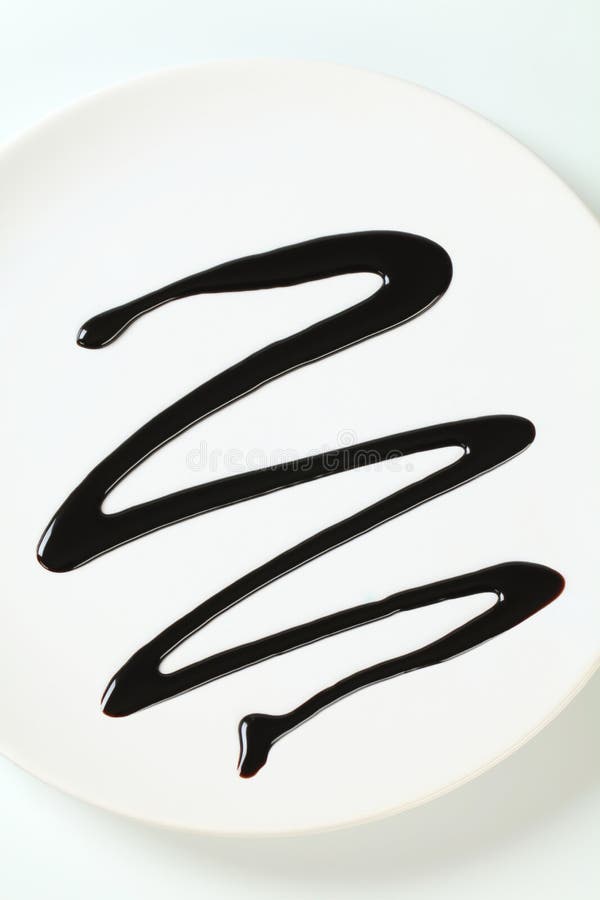 Chocolate syrup on plate stock image. Image of styling - 55975285