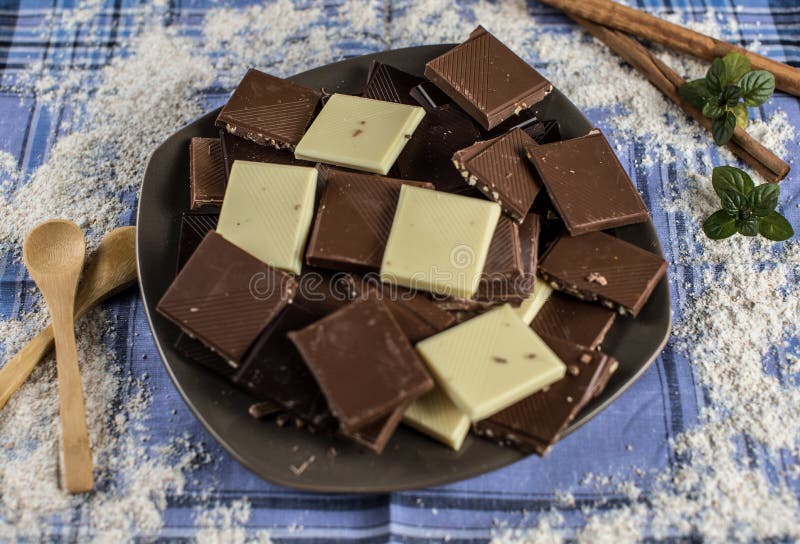 Chocolate Tablet of Different Flavors Placed on Plate with Pieces of ...