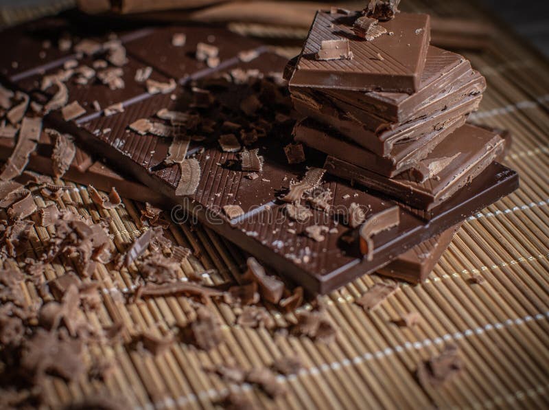 Chocolate Tablet of Different Flavors Placed on Plate with Pieces of ...