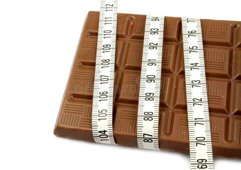 Chocolate and tape measure stock image. Image of eating - 8647329