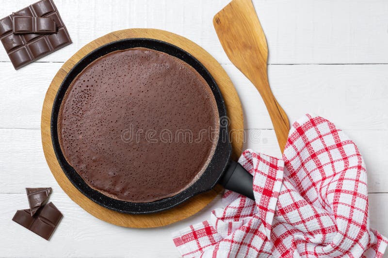 Chocolate Thin Pancake in a Pan on a Wooden Stand. Tasty Breakfast ...