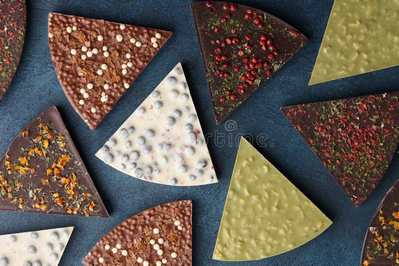 Chocolate Triangle Pieces on Blue Background Stock Photo - Image of ...