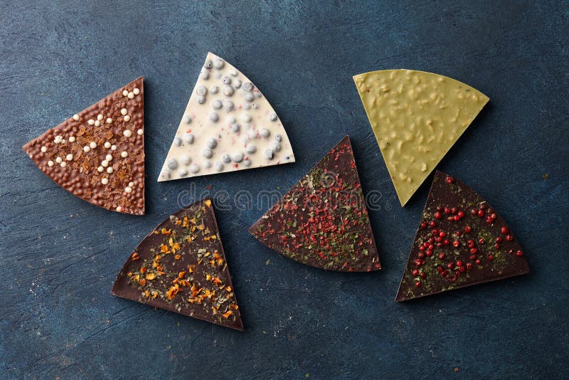 Chocolate Triangle Pieces on Blue Background Stock Photo - Image of ...