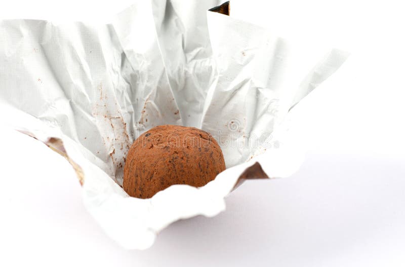 Chocolate Truffle in a Half-developed Wrapper. Delicious Candy Stock ...