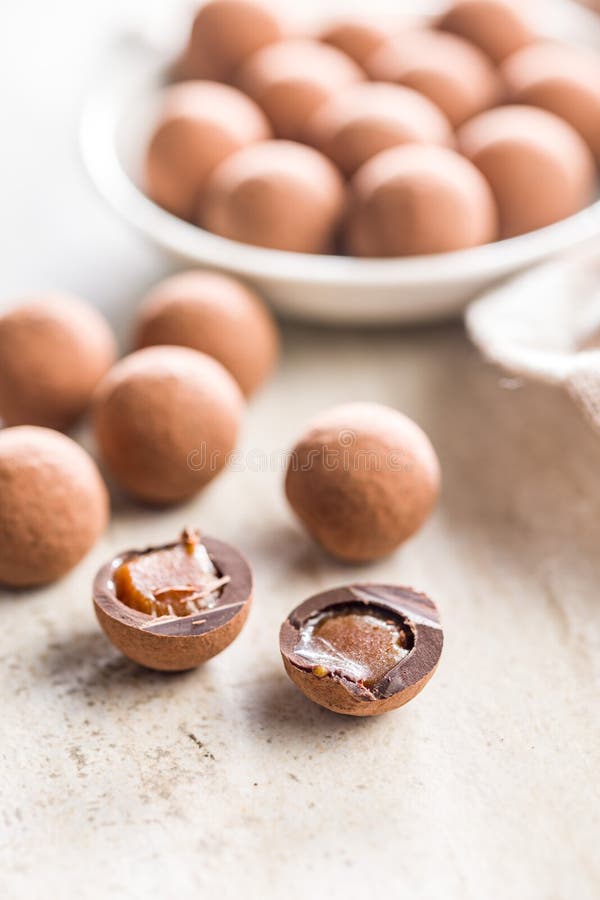 Chocolate Truffles with Cocoa Powder and Caramel Filling on Kitchen ...