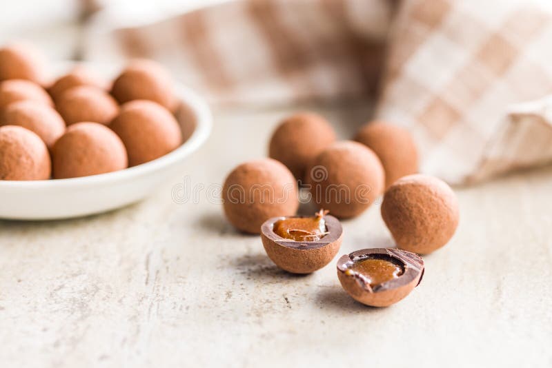 Chocolate Truffles with Cocoa Powder and Caramel Filling on Kitchen ...