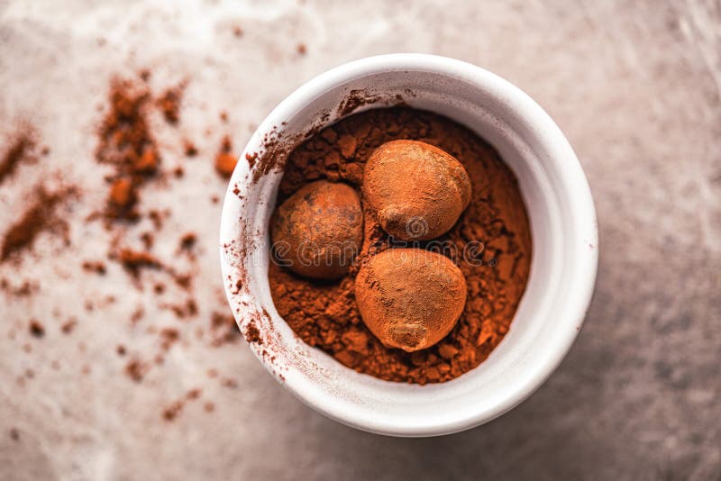 Chocolate Truffles Covered with Cocoa Powder in Bowl on Kitchen Table ...