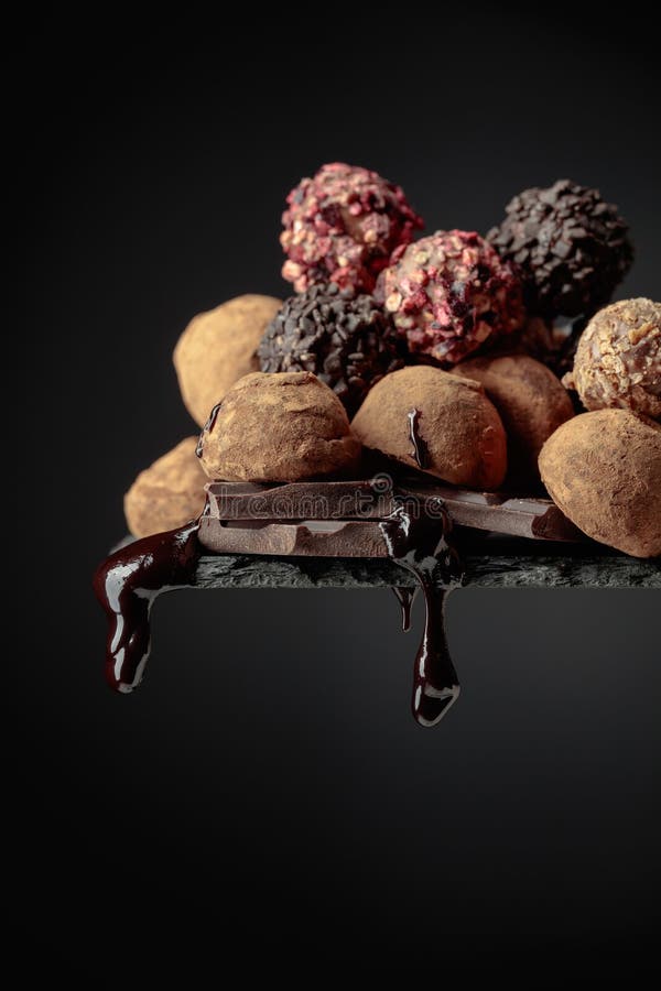 Chocolate Truffles and Falling Drops of Chocolate Sauce Stock Image ...