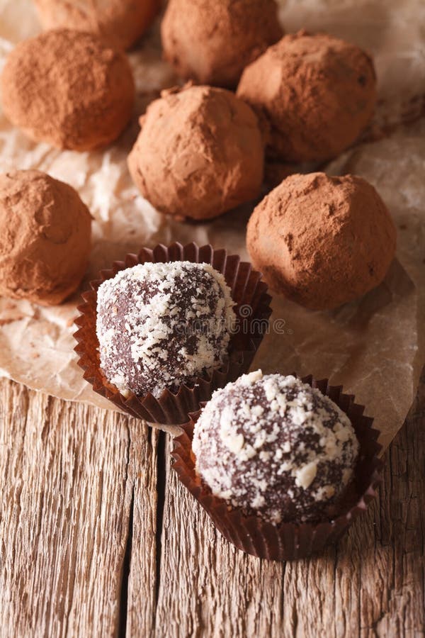 Chocolate Truffles on a Paper Close-up on a Table. Vertical Stock Photo ...
