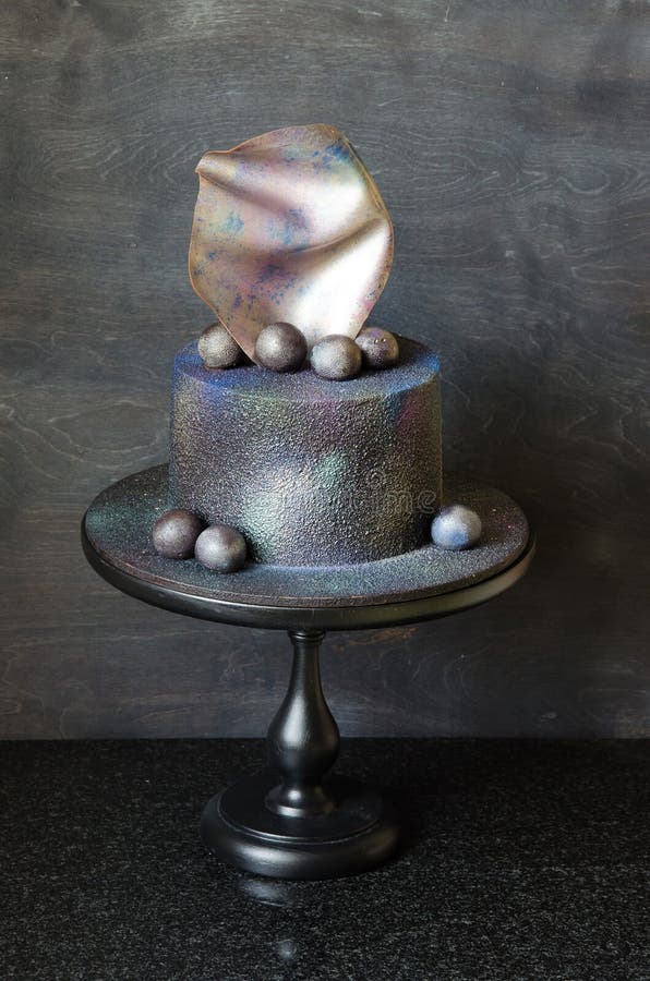 Chocolate Velvet Cake with a Sail and Caramel Spheres Stock Photo ...