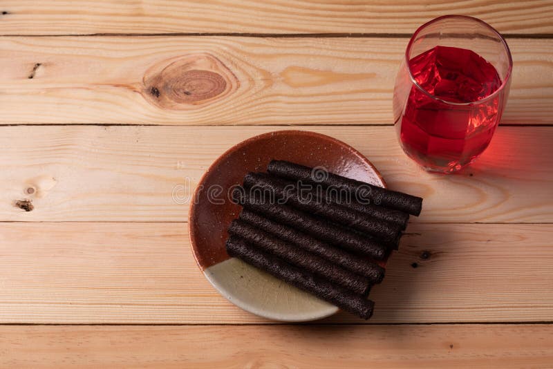 Chocolate Wafer with Red Water. Dark Tone Stock Photo - Image of syrup ...