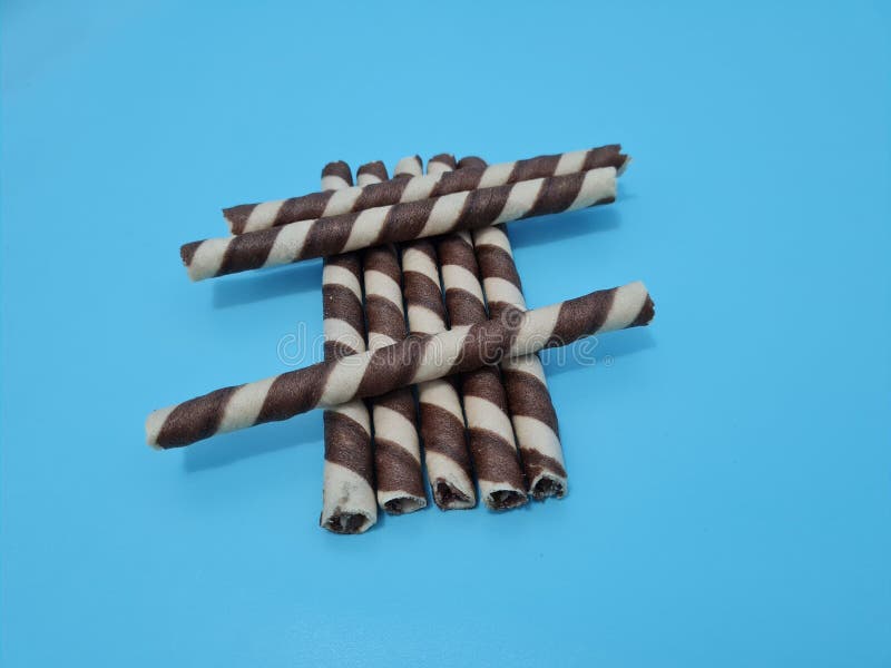 Chocolate Wafer Rolls on a Blue Background, Top View. Stock Image ...