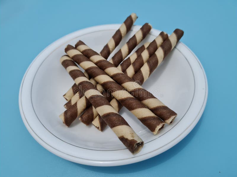 Chocolate Wafer Rolls on a Blue Background, Top View. Stock Image ...
