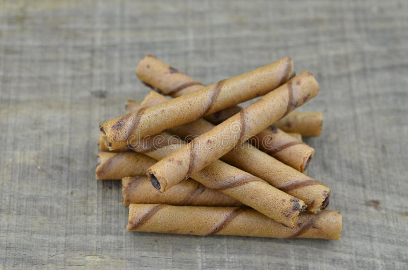Chocolate Waffle Roll Sticks on Wooden Background Stock Image - Image ...
