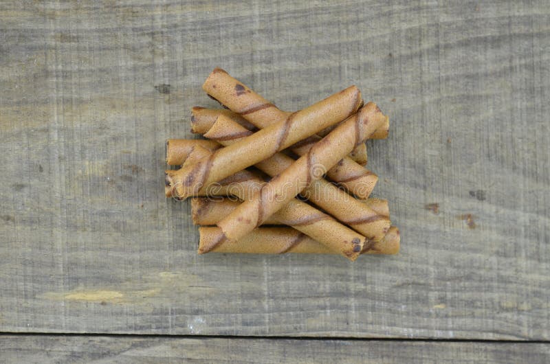 Chocolate Waffle Roll Sticks on Wooden Background Stock Photo - Image ...