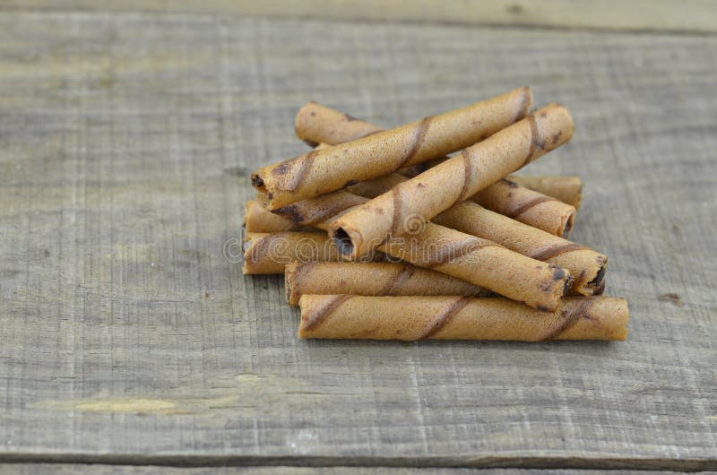 Chocolate Waffle Roll Sticks on Wooden Background Stock Image - Image ...