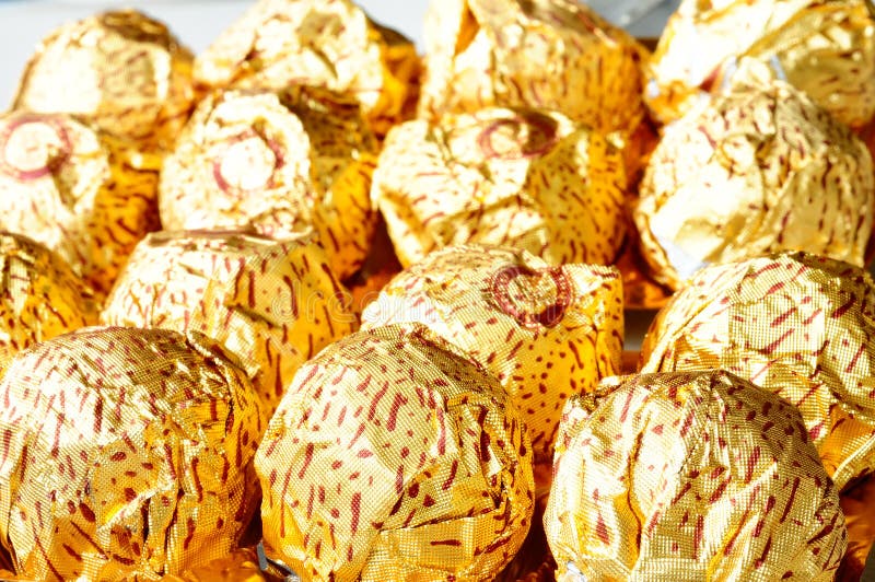 Chocolate Wrapped in Gold Foils Stock Photo - Image of festive, food ...