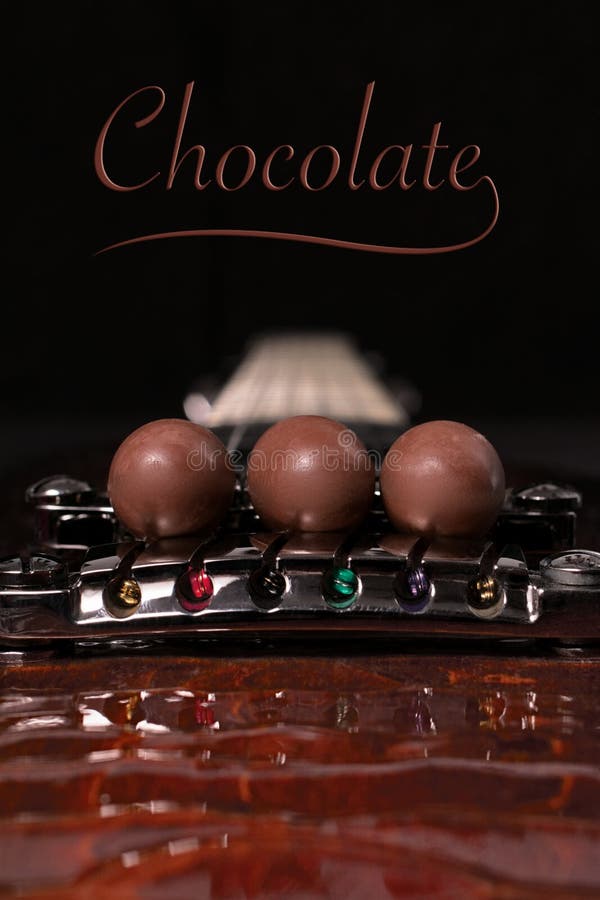 Chocolates on the guitar stock image. Image of background - 51794653