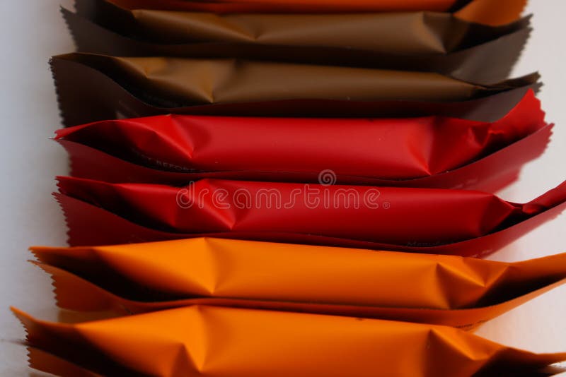 Chocolates White Background.Different Color Chocolate Package Stock ...