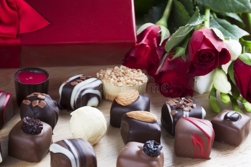 Chocolates and Red Roses stock photo. Image of romantic - 28411058