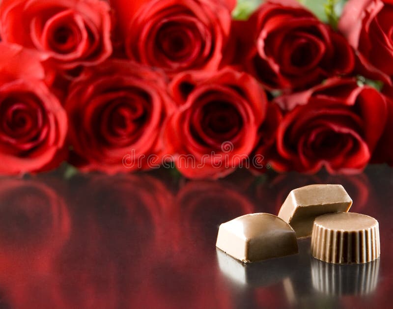 Chocolates with red roses stock photo. Image of eating - 5344624