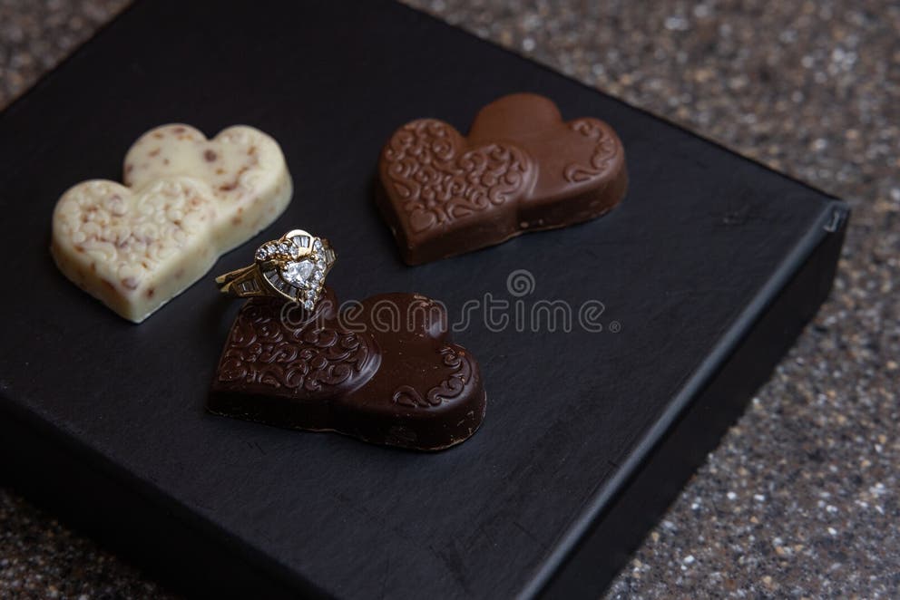 Chocolates and a ring stock photo. Image of present - 268859376