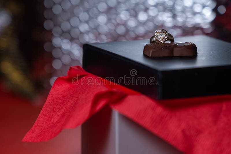 Chocolates and a ring stock image. Image of gesture - 268859699