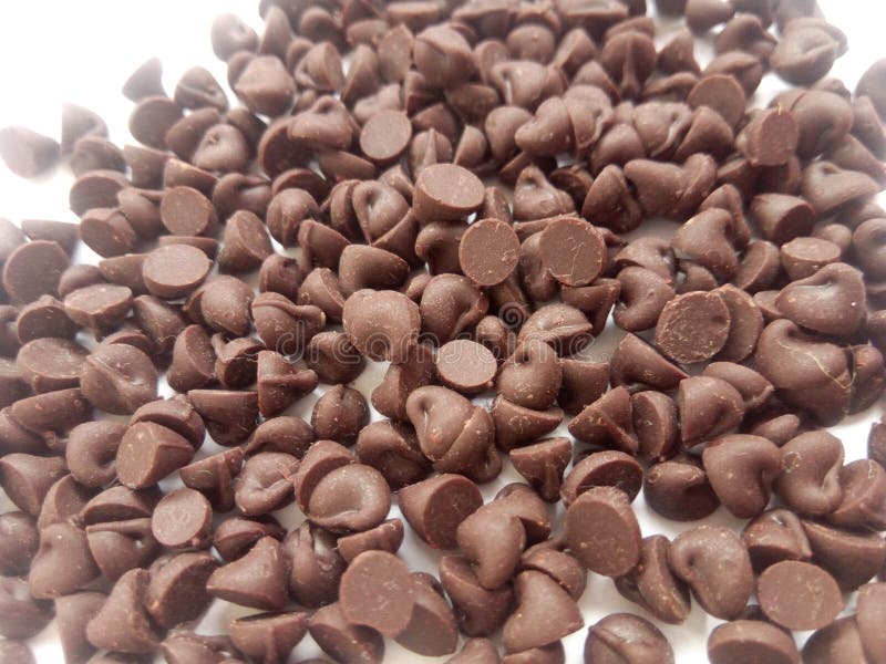 CHOCO CHIPS on PLAIN BACKGROUND Stock Photo - Image of baking, brown ...