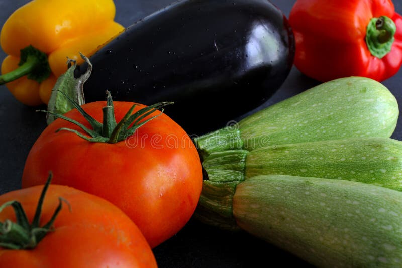 Choice of Vegetables on Dark Board Stock Image - Image of tomatoes ...